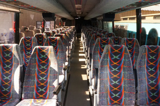 Maroon VanHool 57 Passenger Charter Bus - Mikes Limousine